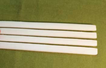 White Teflon 4 Finger Paddle